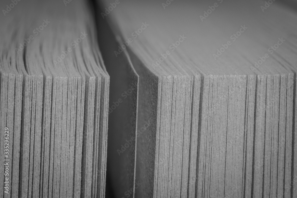 Closeup of a partly open book with a gap in between - black and white ...