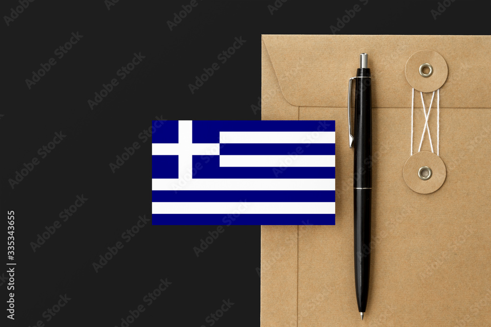 Greece flag on craft envelope letter and black pen background. National ...