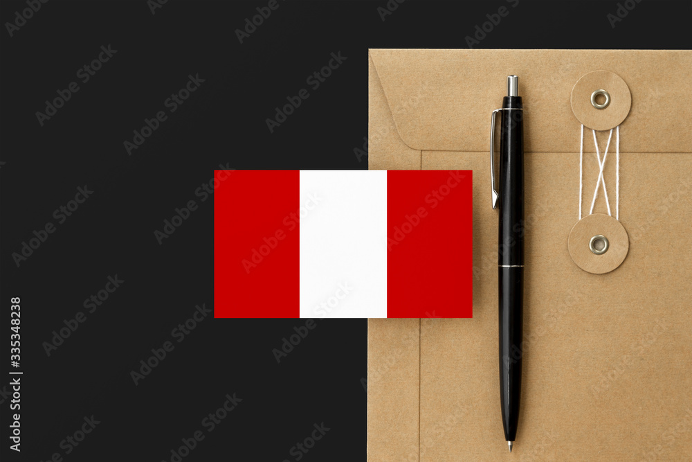 Peru flag on craft envelope letter and black pen background. National ...