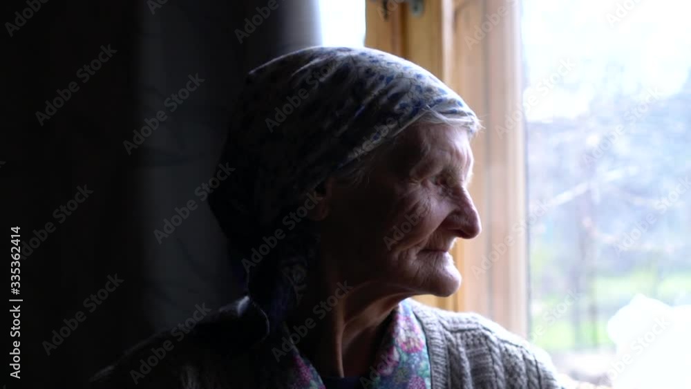 Village style granny profile. Old lady looks into window. Lonely senior ...