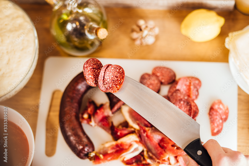 Homemade dry cured smoked spicy sausage.Delicatessen meats. Charcuterie ...