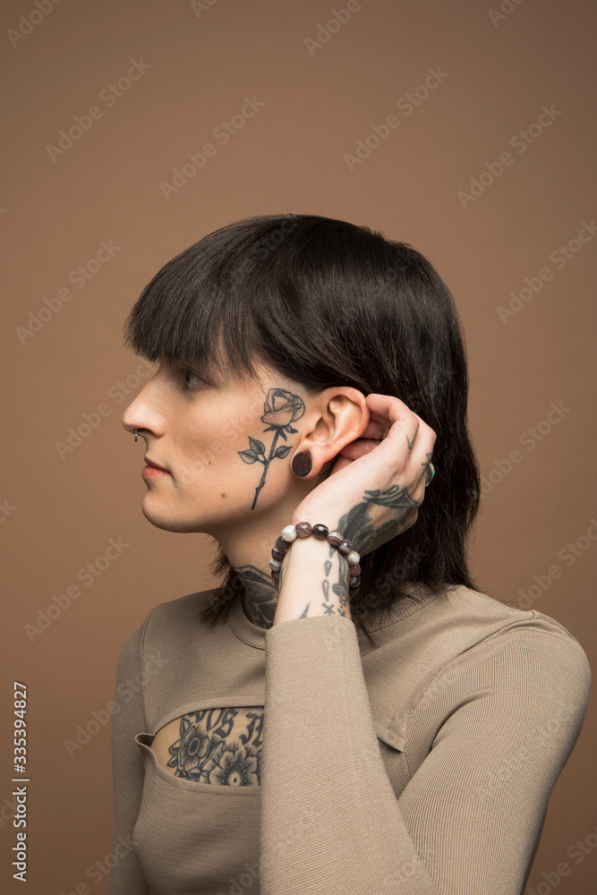Portrait of transgender woman with tattoos and piercings Stock Photo ...