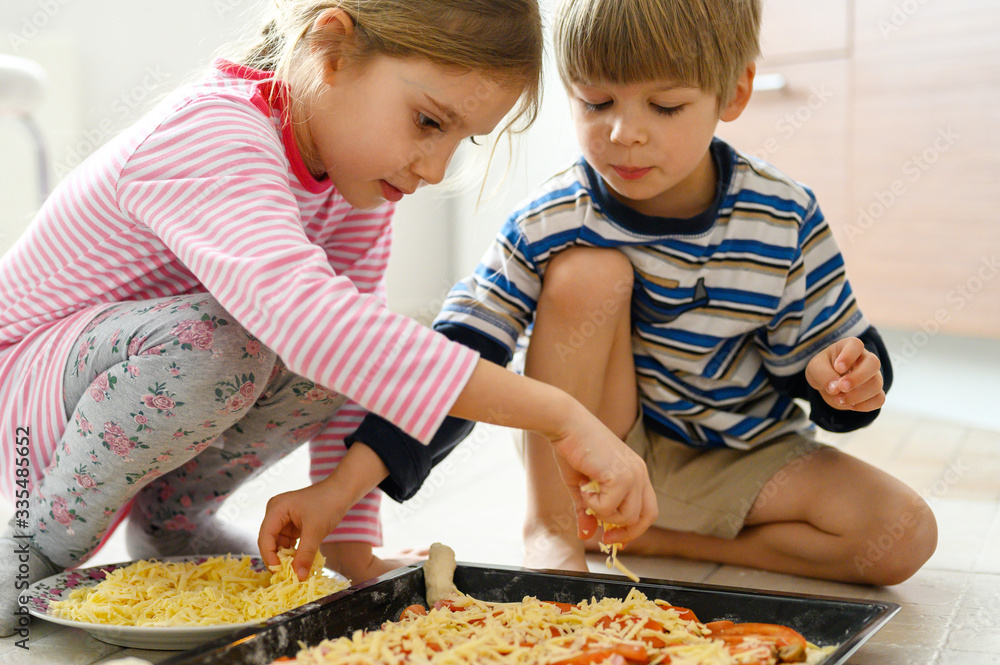 happy family make food at home. little kids son and daughter helps his ...