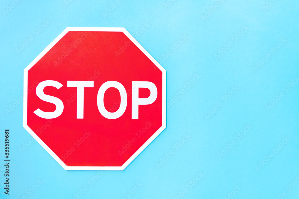 Red prohibition road sign stop on left part of blue background ...