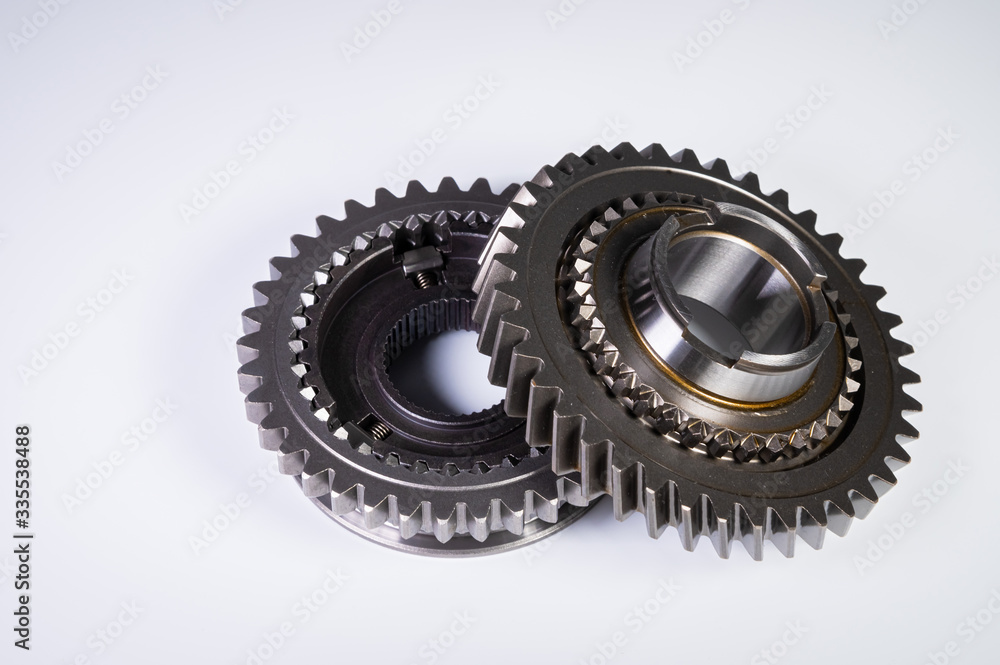New parts on a gray background. Gears of gear shifting torque ...