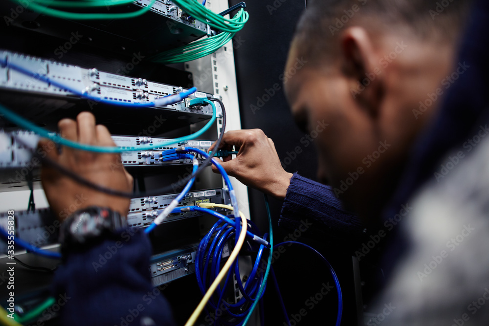 Service engineer working on a server Stock Photo | Adobe Stock