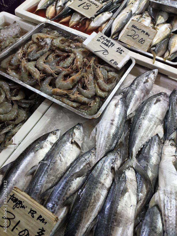 Various types of fish in the fish market are displayed for sale ...
