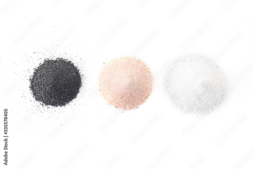 three types of salt lie on a white background - black, pink, white ...