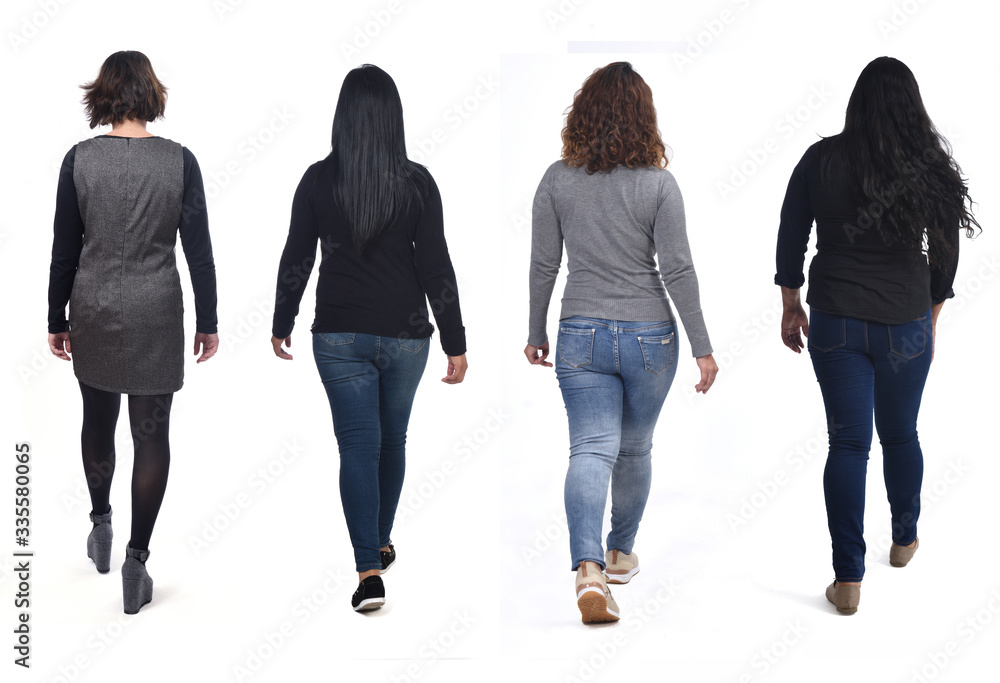 group of women walking on white background, rear view Stock Photo ...