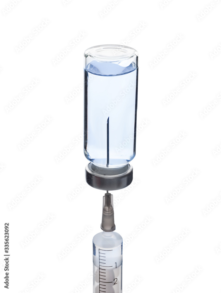medical ampoule and syringe with blue transparent liquid on a white ...