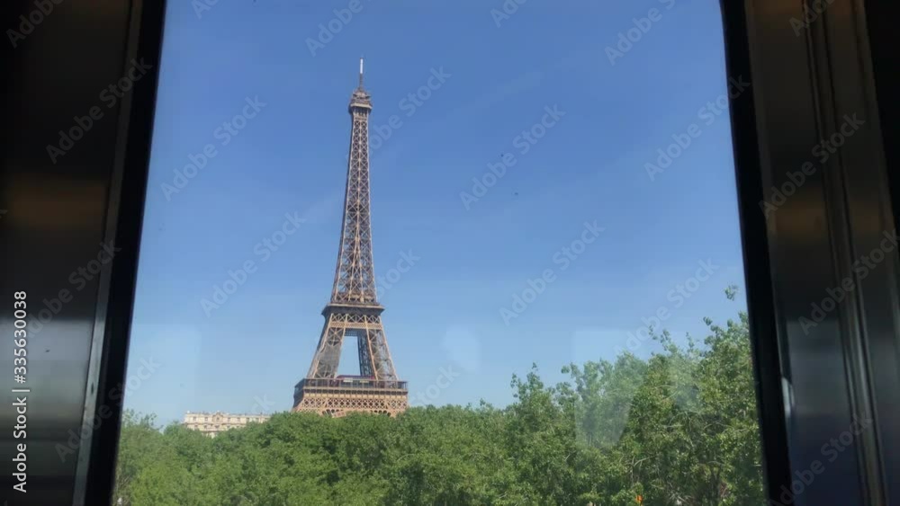 View from the window of parisian metro on the city and Eiffel tower from bridge Bir Hakeim ...