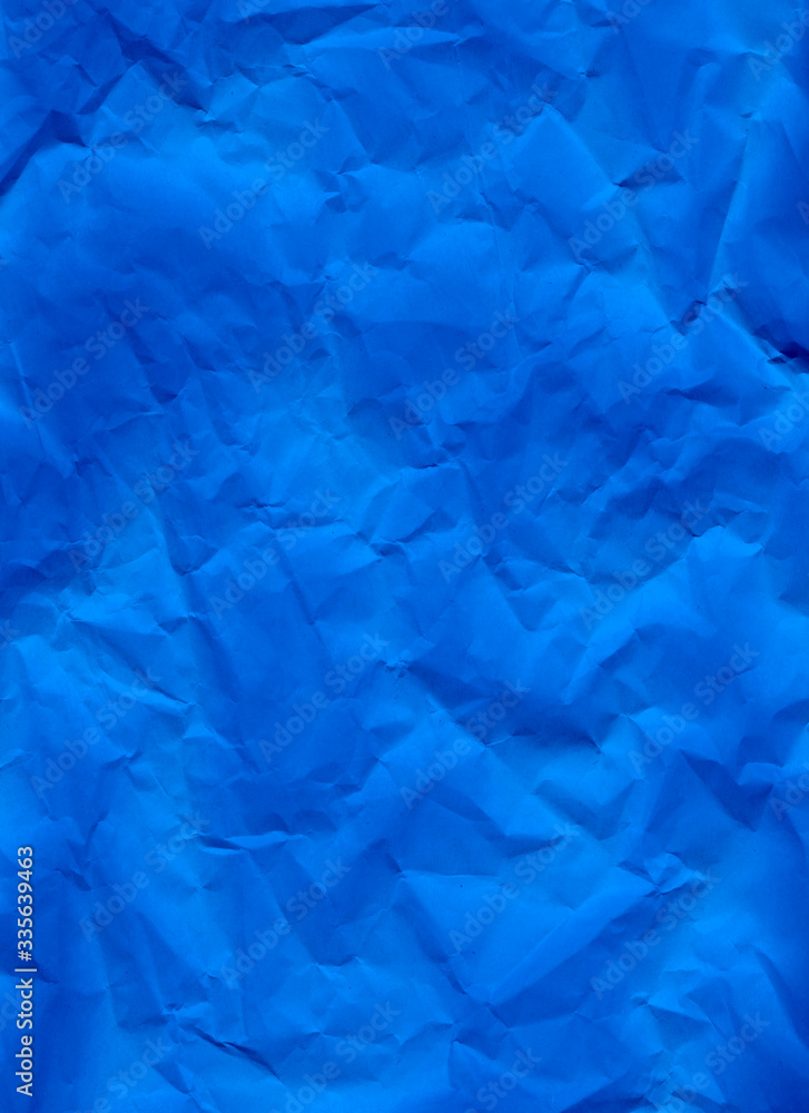 Blue crumpled paper texture background. A close-up abstract macro photo ...