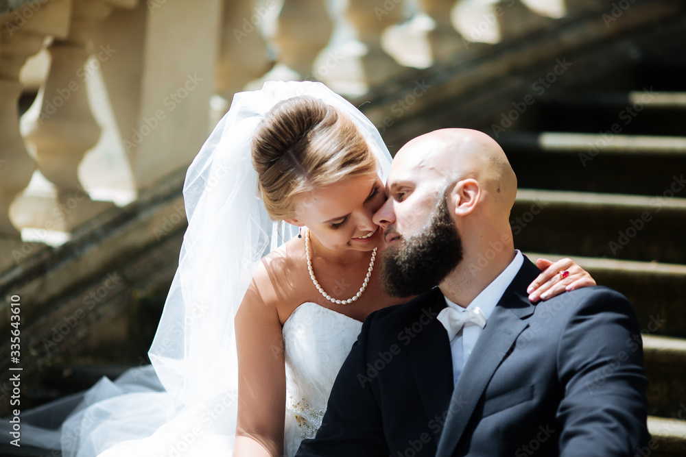 Full length portrait of newlywed couple and their friends at the ...