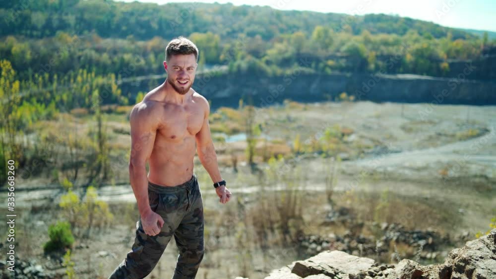 Portrait of bodybuilder on nature background in summer. Handsome ...