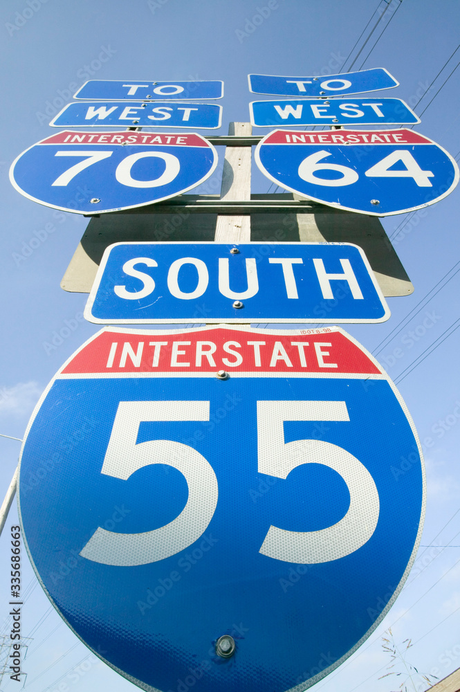Interstate highway signs show the intersection of Interstate 70, 64 and ...
