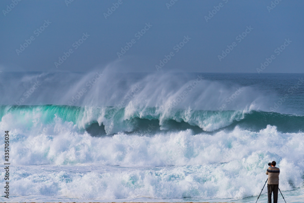 Giant breaking waves along the beach -Nazare North Beach, Portugal is ...