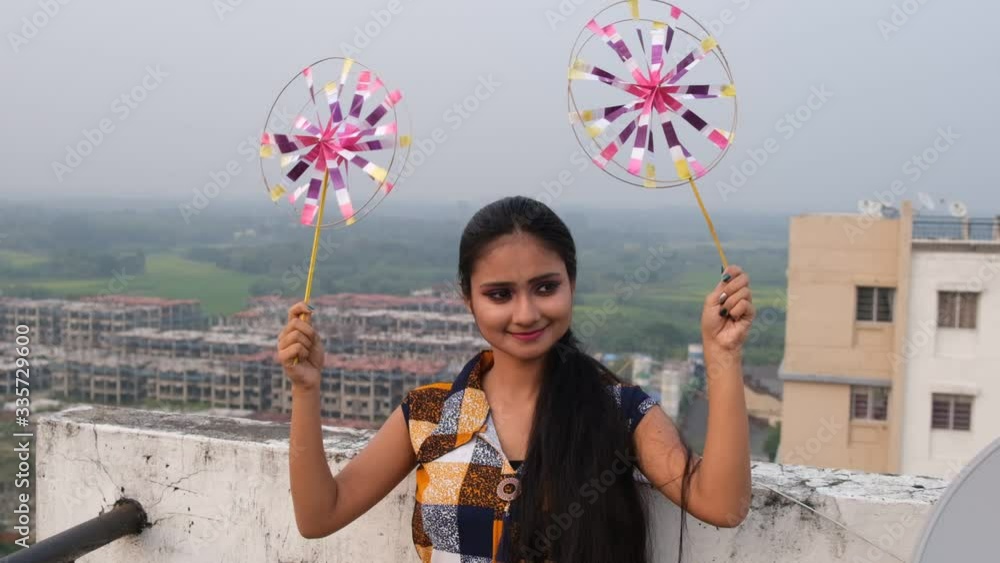 An young and attractive Indian Bengali brunette girl in western dress ...