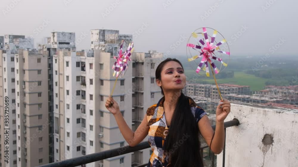 An young and attractive Indian Bengali brunette girl in western dress ...