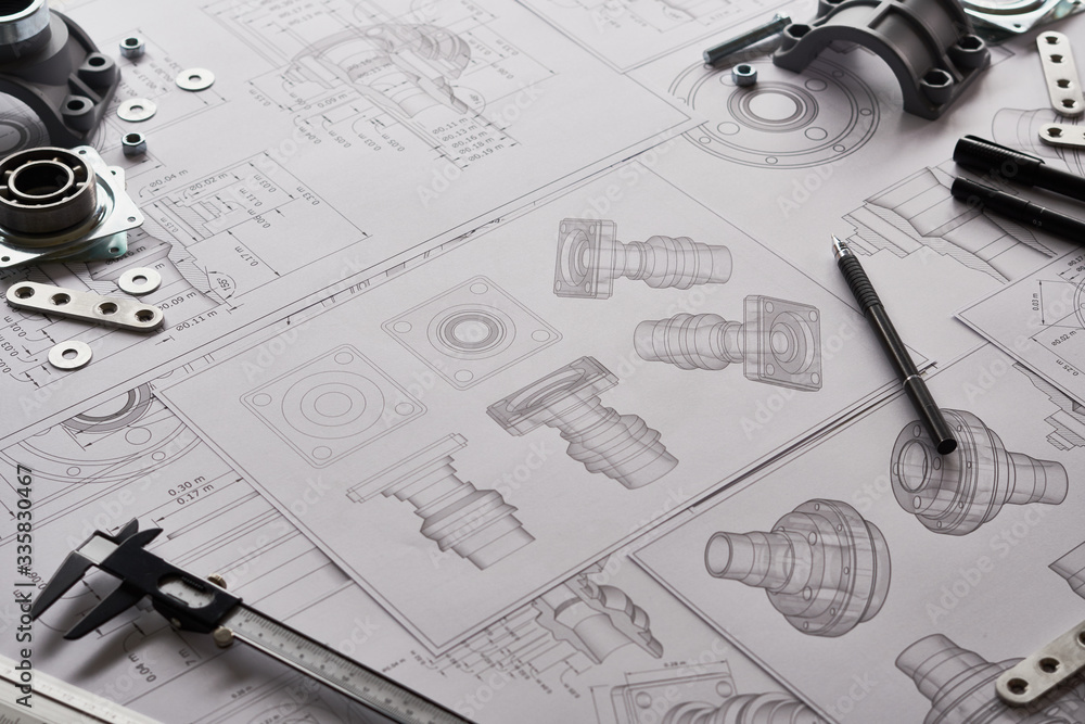 Engineer technician designing drawings mechanical parts engineering ...