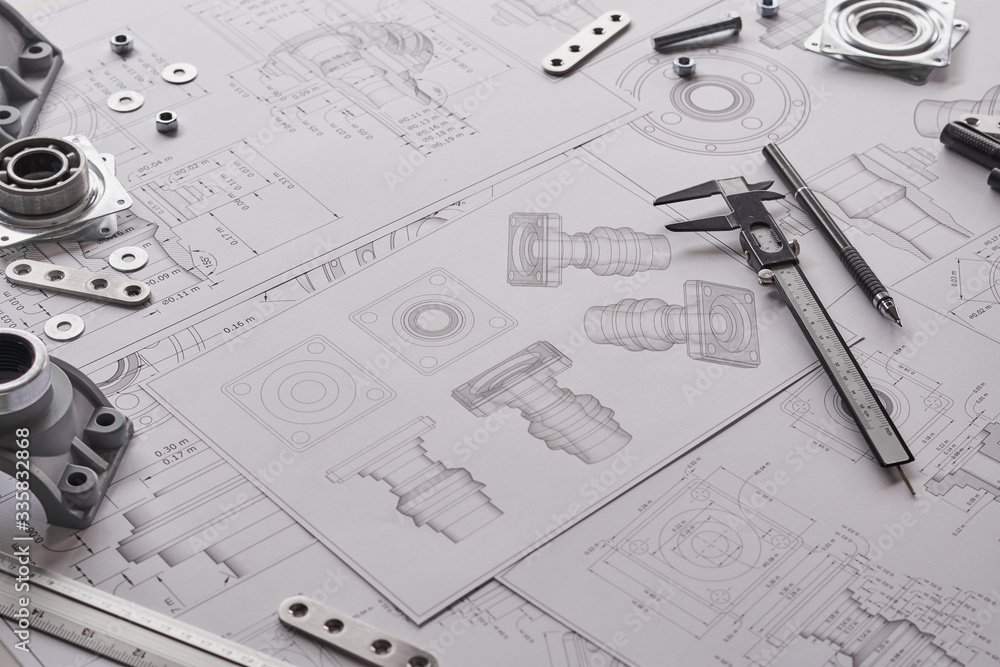 Engineer technician designing drawings mechanical parts engineering ...