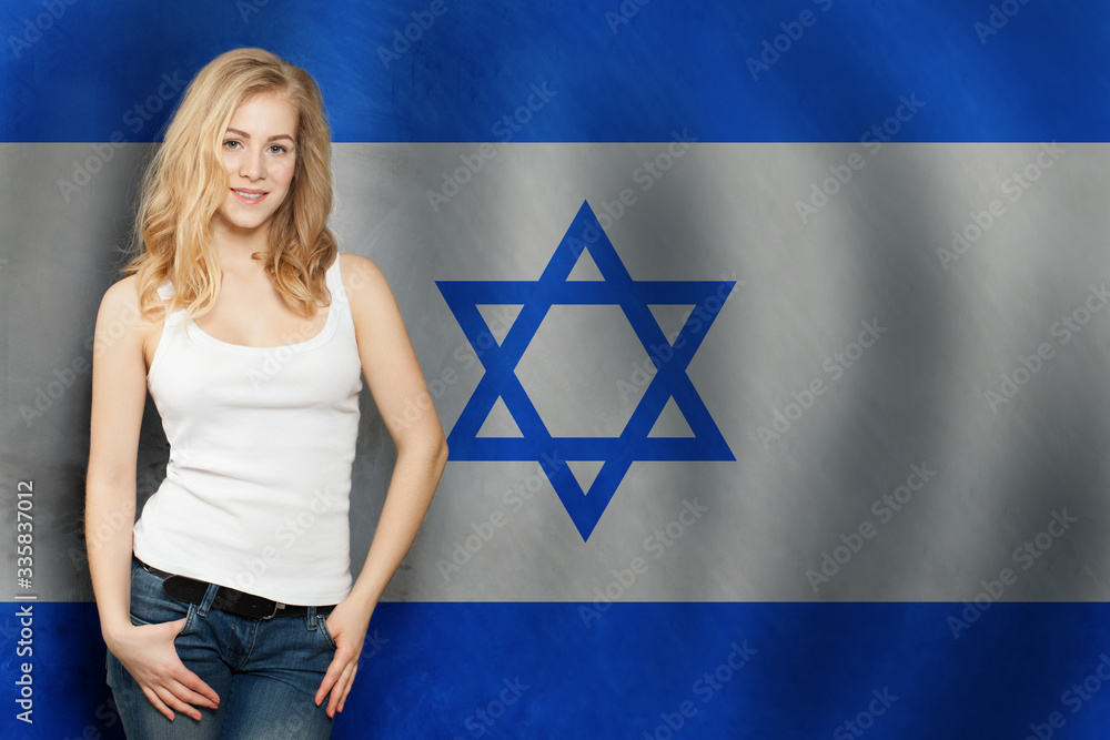 Happy cute young woman against the Israel flag background. Live ...
