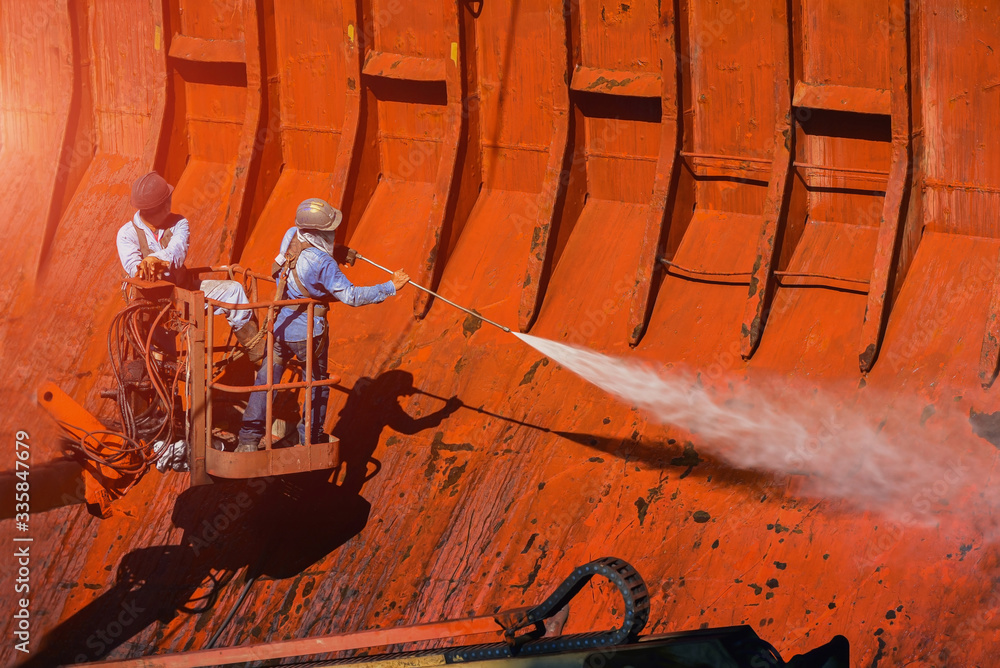 Washing and cleaning, worker High pressure water jet to cleaning with ...