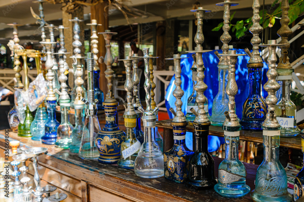 Shisha pipes on a shelf in the Hookah Lounge of a Turkish restaurant ...