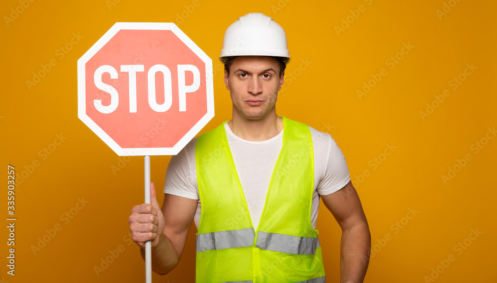 Close up photo of young serious and confident foreman or architect in ...