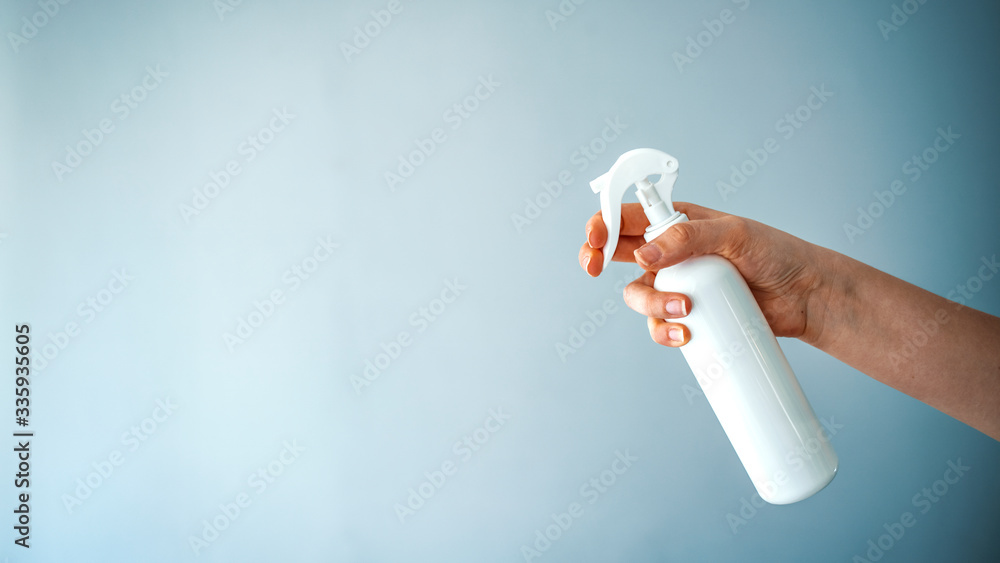 Caucasian woman wipes her hands with an alcohol-based hand-washing ...