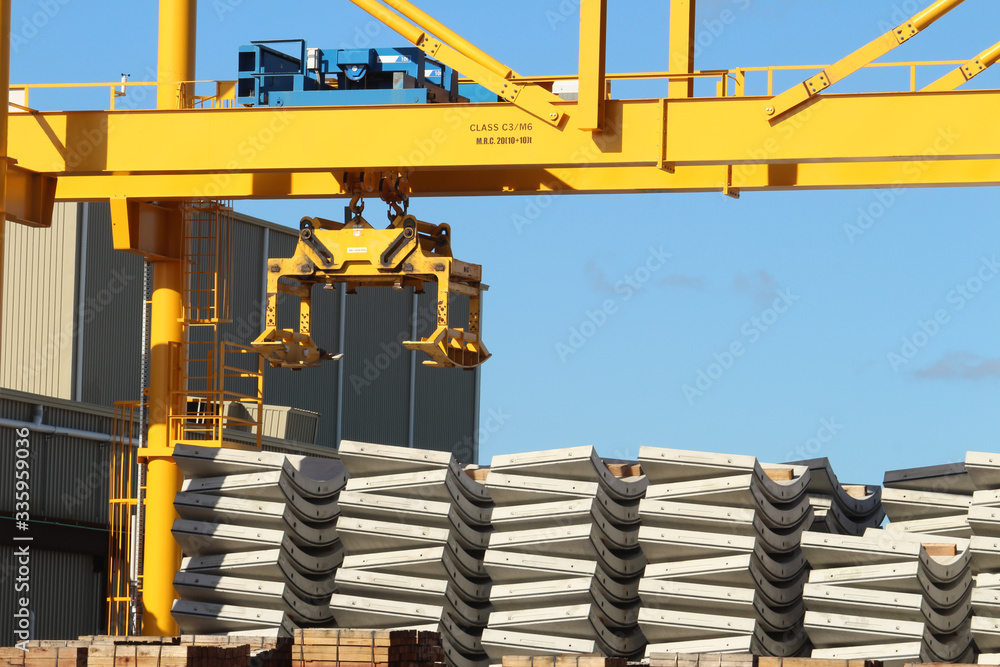 Outdoor yellow overhead crane on an underground tunnel manufacturing ...
