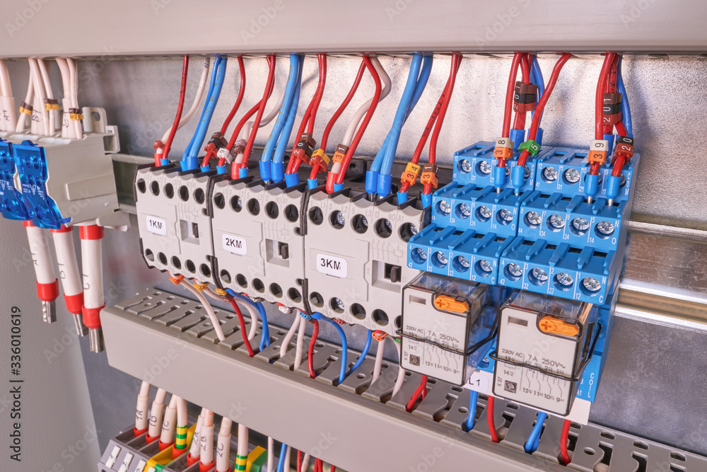 Two intermediate relays, three contactors or magnetic starters, a cross ...