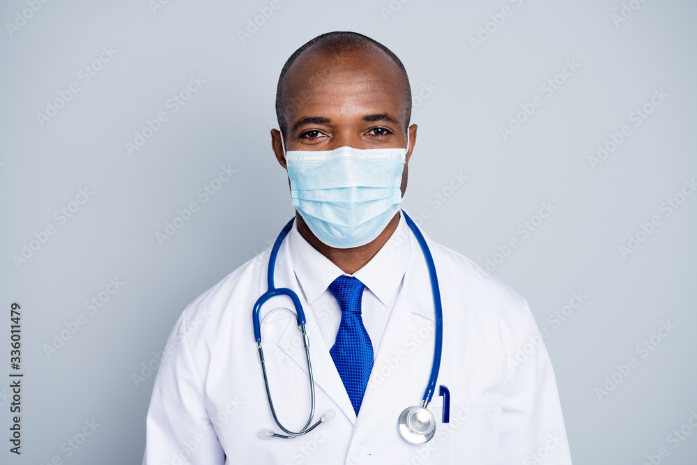 Stay home for us. Photo of family doctor dark skin guy examining ...
