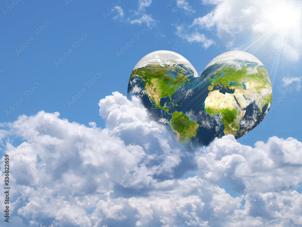 Planet earth in heart shape in sky above the clouds. Earth day concept ...