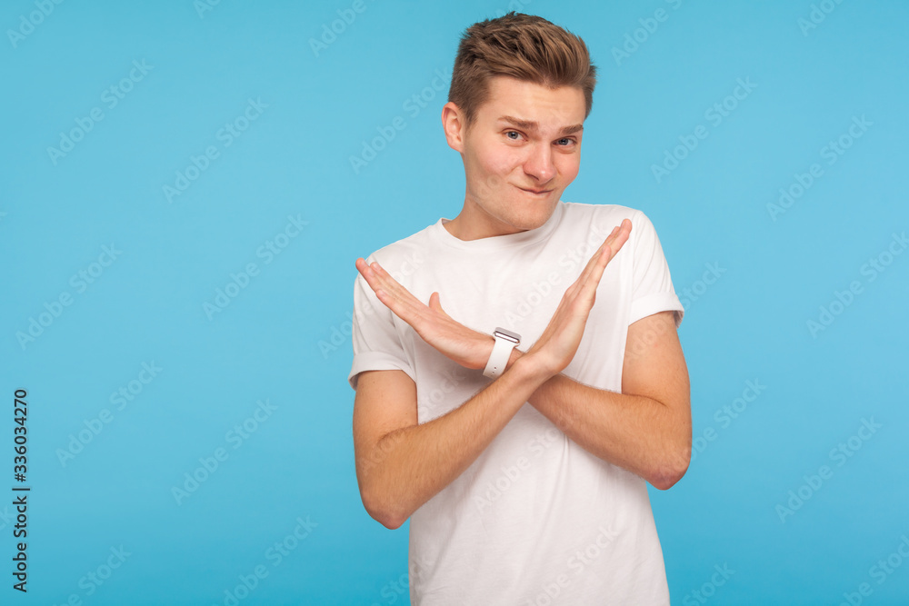 No more, finish! Portrait of dissatisfied man in t-shirt raising hands ...