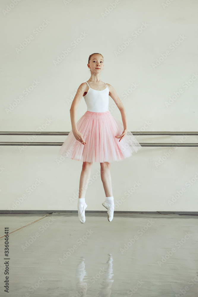 small ballerina girl dancer. Cute little dancing, jumping. Young dancer ...