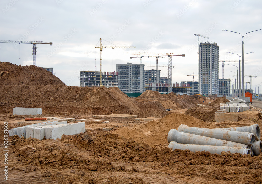 Drainage pipes at the large scale construction site against tower ...