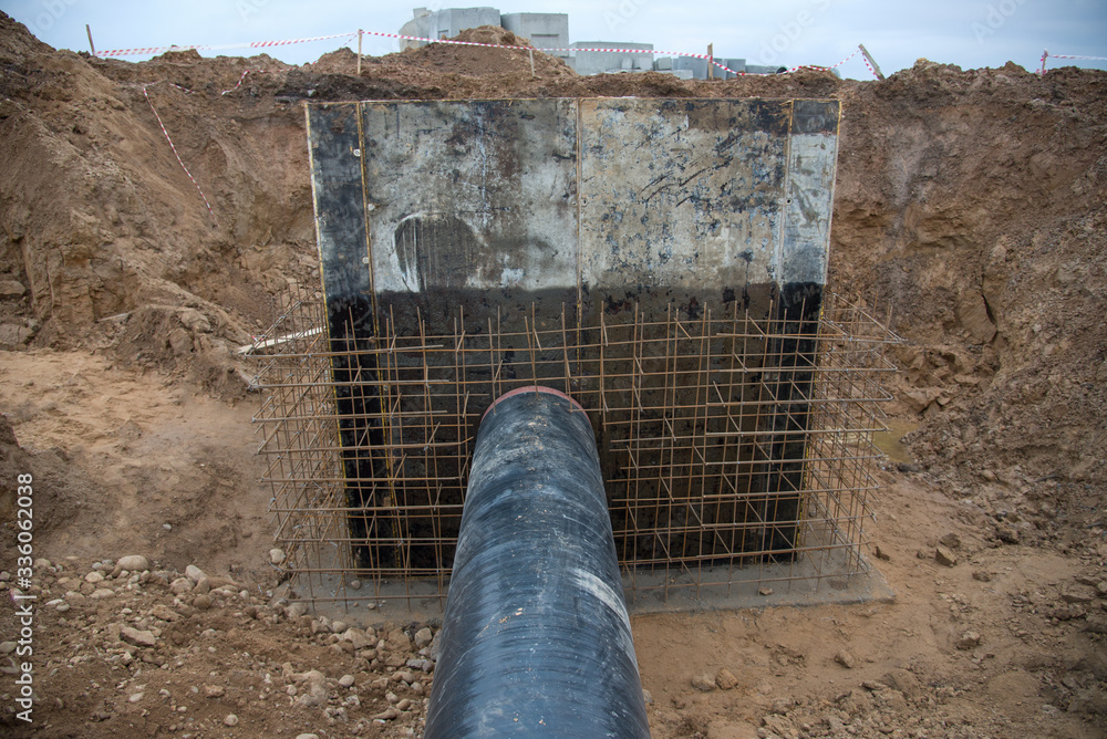 Connecting a trench drain to a concrete manhole structure at ...