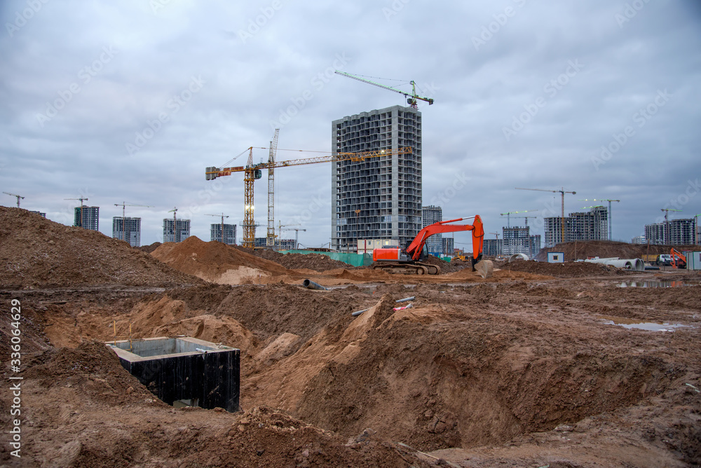 Excavtor and bulldozer digg ground at construction site for the ...