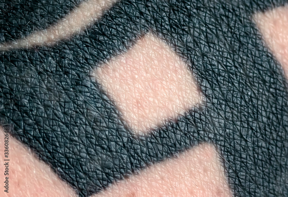 background with human skin texture with stuffed dark blue and black ...