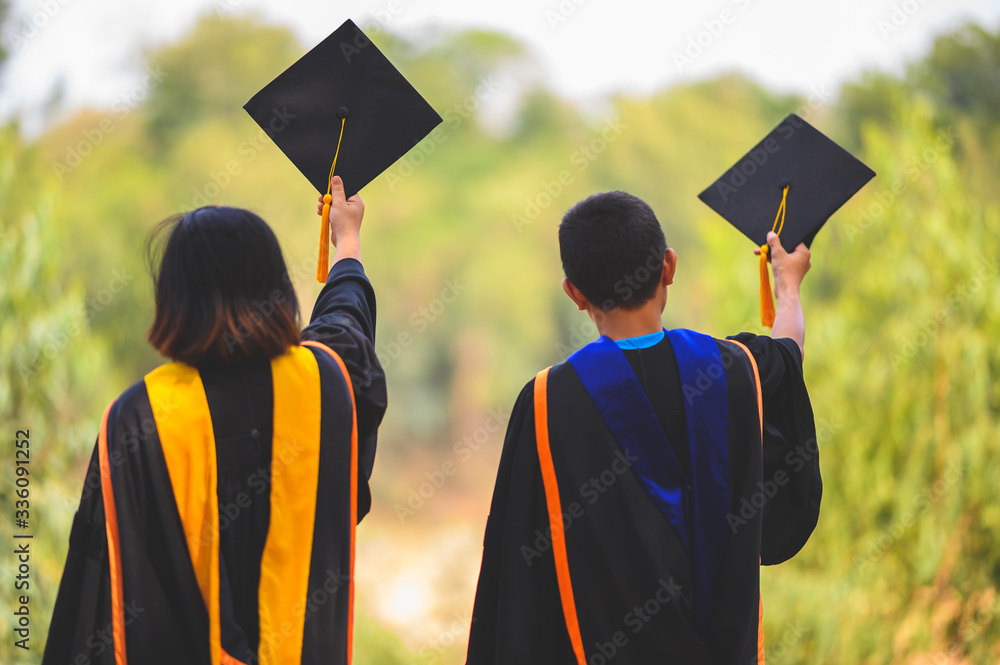 Asian students wore black frilly suits, black hats, yellow tassels on ...