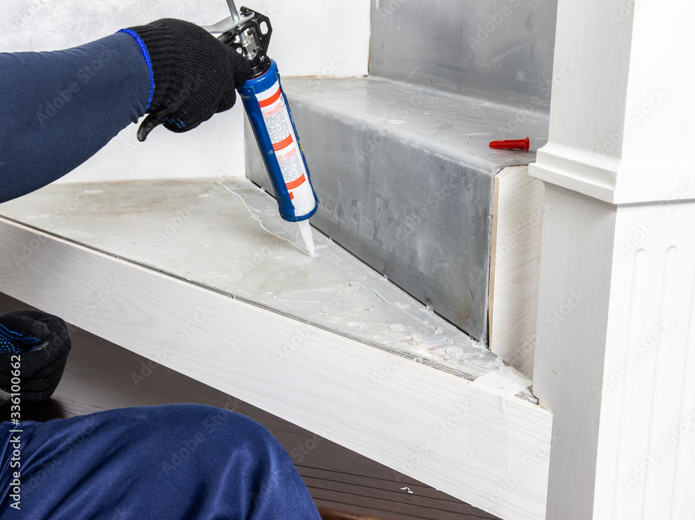 Repair of a ladder by the master. Professional installation of a flight ...