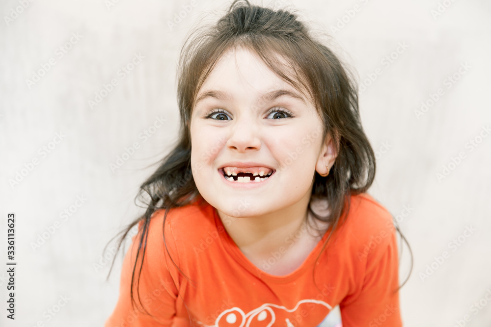 defocused funny close up face portrait of Little agressive naughty girl ...