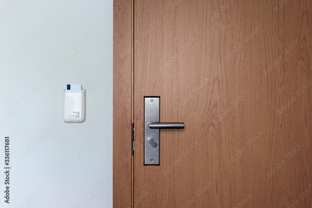 Hotel key card door lock system. Wooden door with electronic lock ...