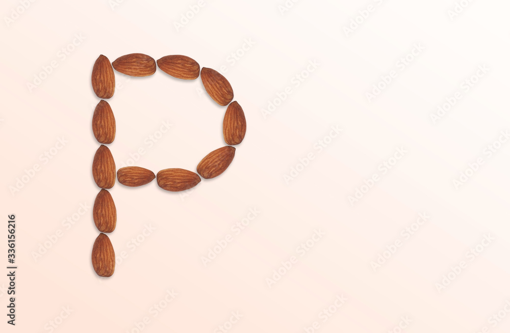 Letter P of the English alphabet from nuts. Food pattern made from nuts ...