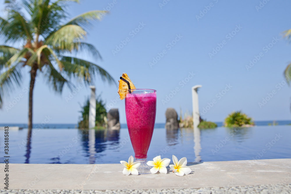 Deliciously punch juice by the swimming pool. A glass of cocktail from ...