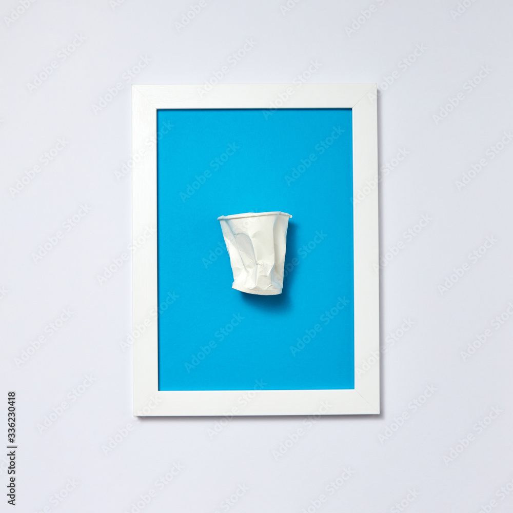 Crumpled plastic cup in blue frame on a light background Stock Photo ...