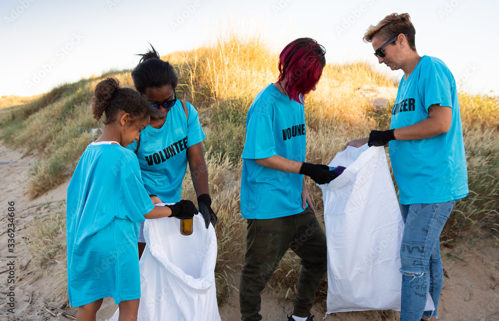 Volunteer beach clean up Stock Photo | Adobe Stock
