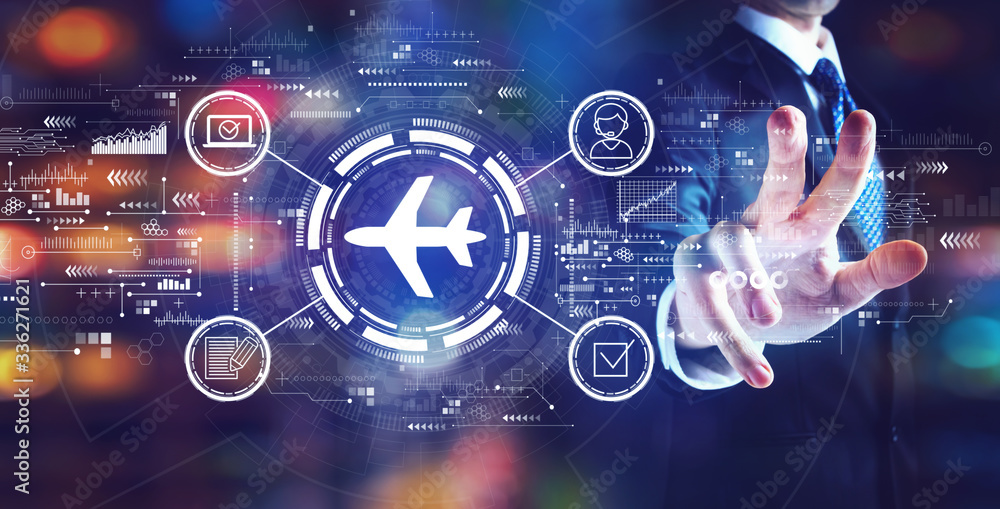 Flight ticket booking concept with businessman on night city background ...
