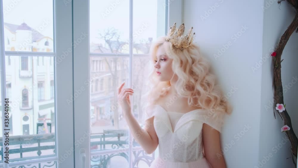 portrait romantic beautiful elegant sad woman princess at window ...
