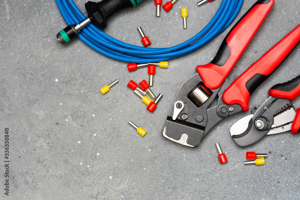 Tools and tips of different sizes and colors for crimping stranded ...